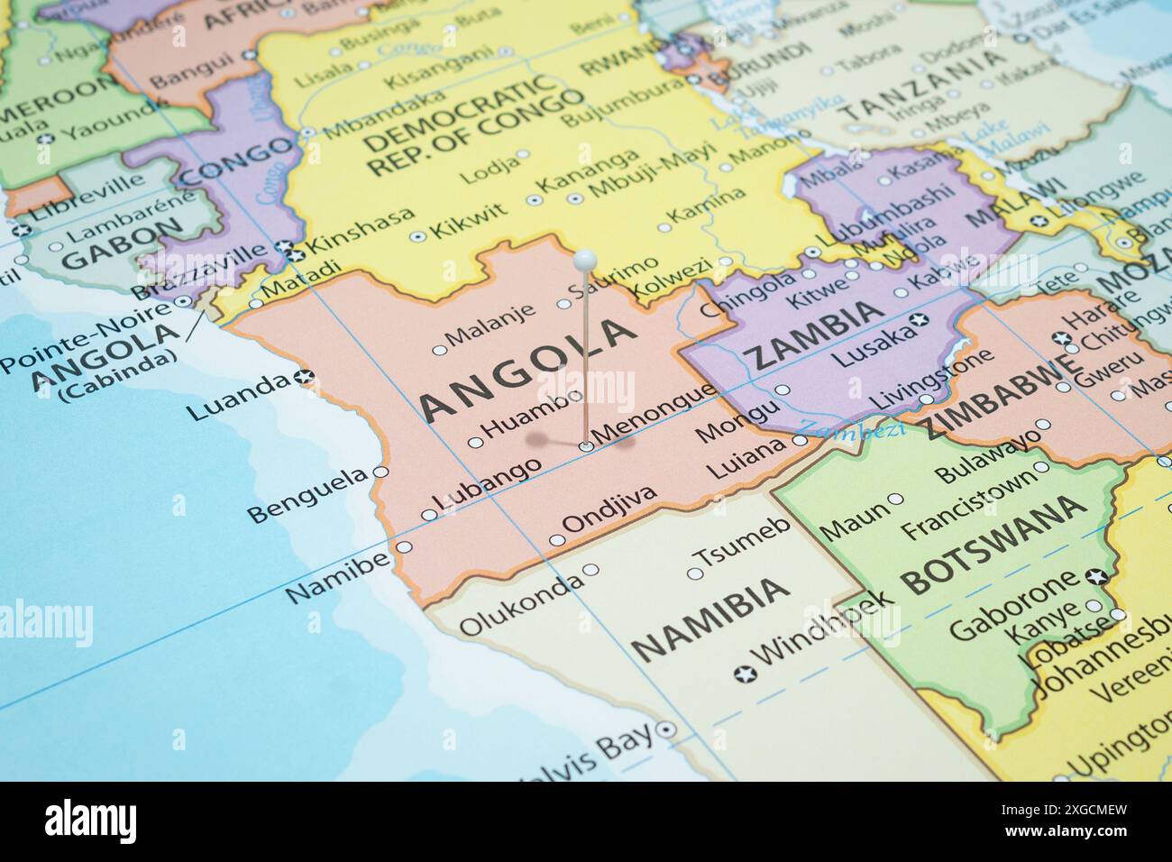 Close up to a Menongue city with a white pin needle into Angola country ...