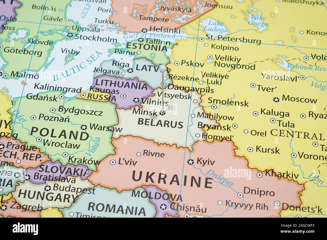 Close up to a Minsk city with a white pin needle into Belarus country ...