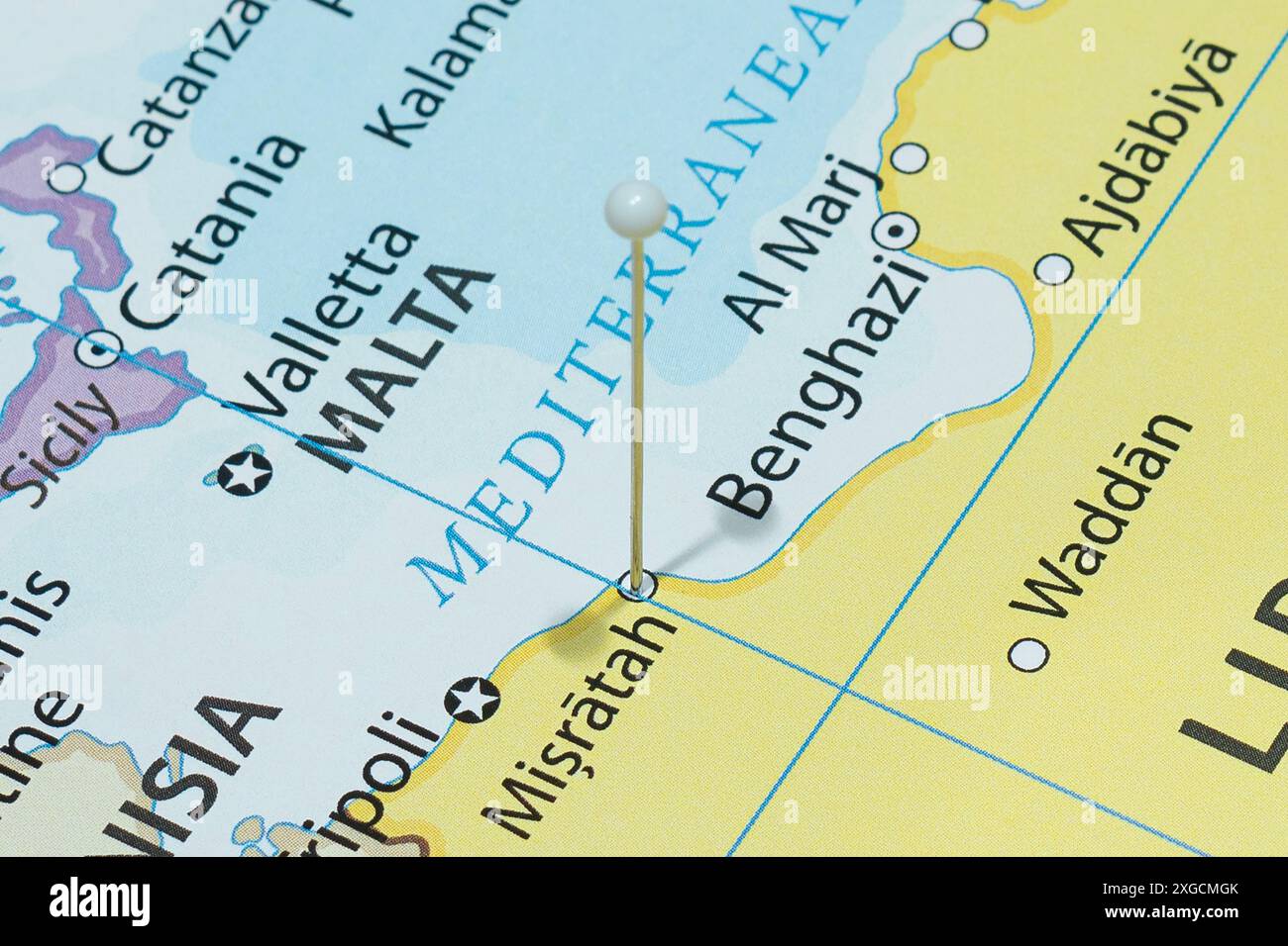 Close up to a Misratah city with a white pin needle into Libya country ...