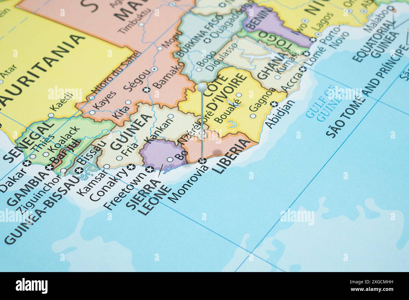 Close up to a monrovia city with a white pin needle into Liberia ...