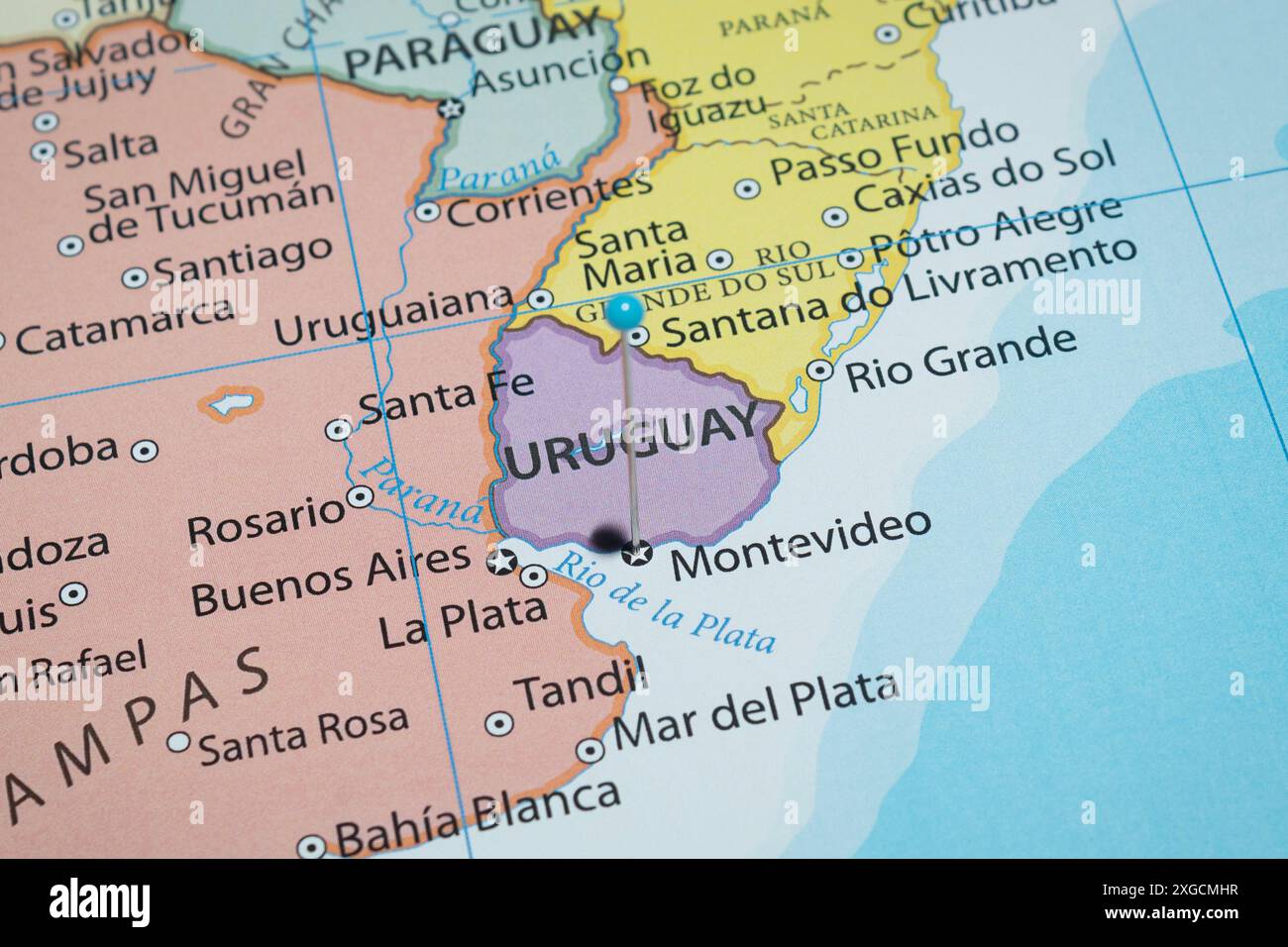 Macro photo of Montevideo city with a light blue pin needle into ...