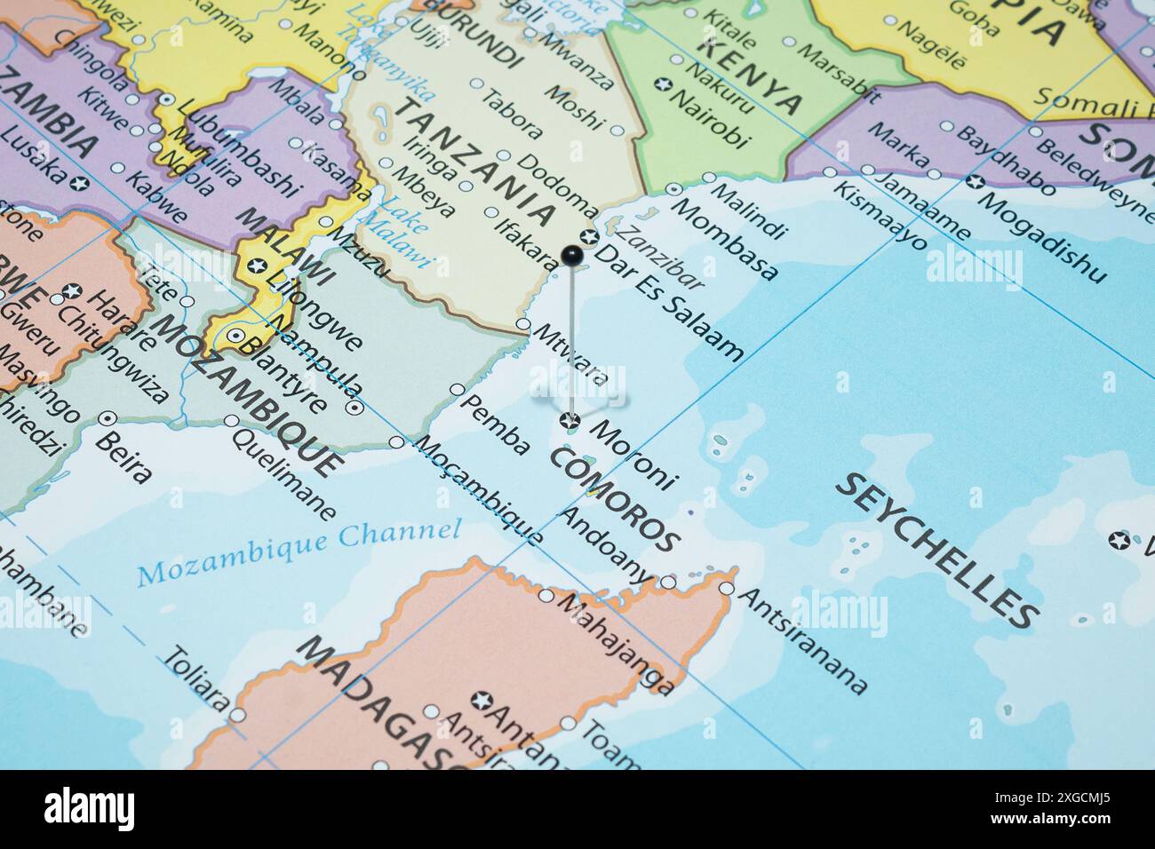 Close up to a Moroni city with a black pin needle into Comoros country ...