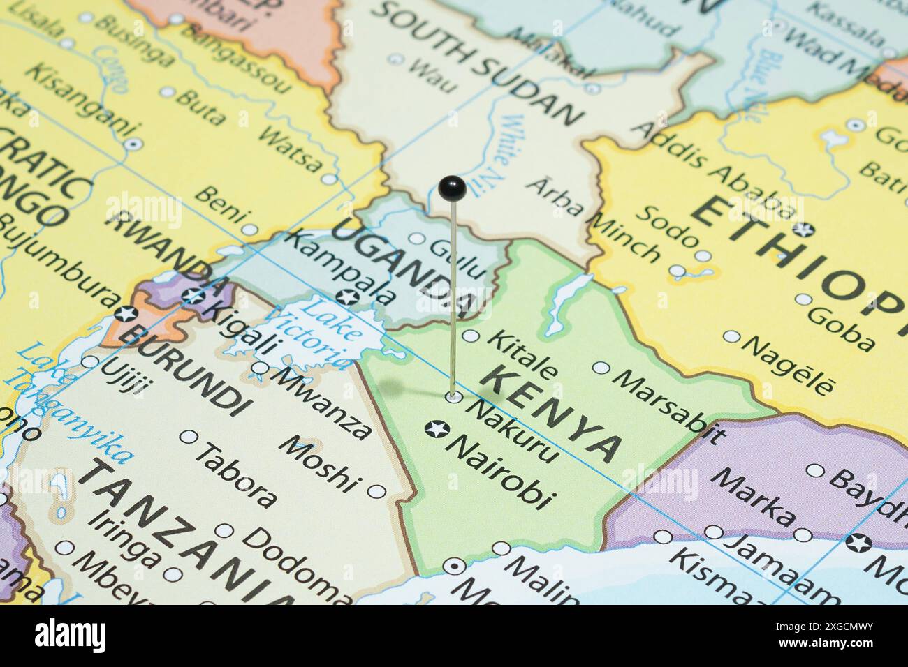 Close up to a Nakuru city with a black pin needle into Kenya country ...