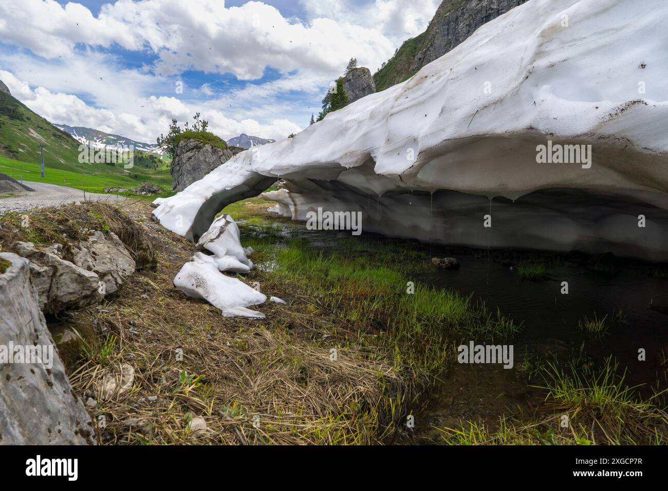 rest from avalanche, snow melting in the Alps of Vorarlberg make tunnel ...