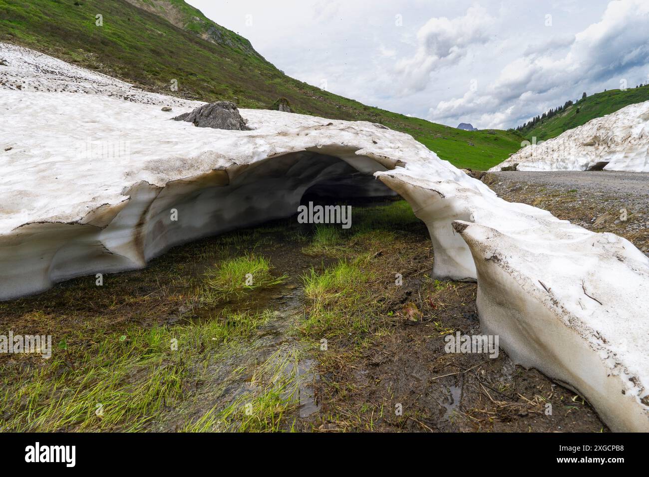 rest from avalanche, snow melting in the Alps of Vorarlberg make tunnel ...