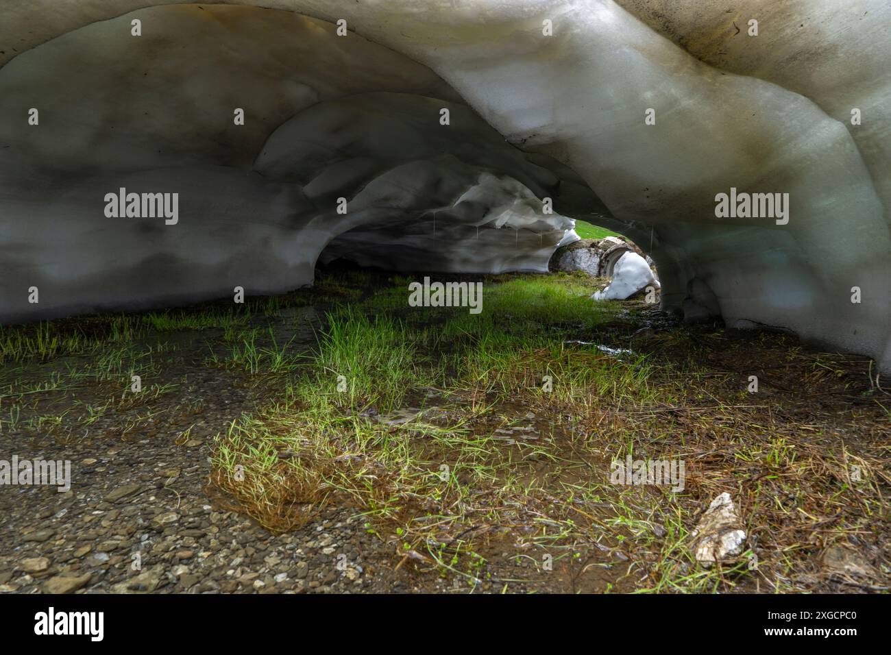 rest from avalanche, snow melting in the Alps of Vorarlberg make tunnel ...