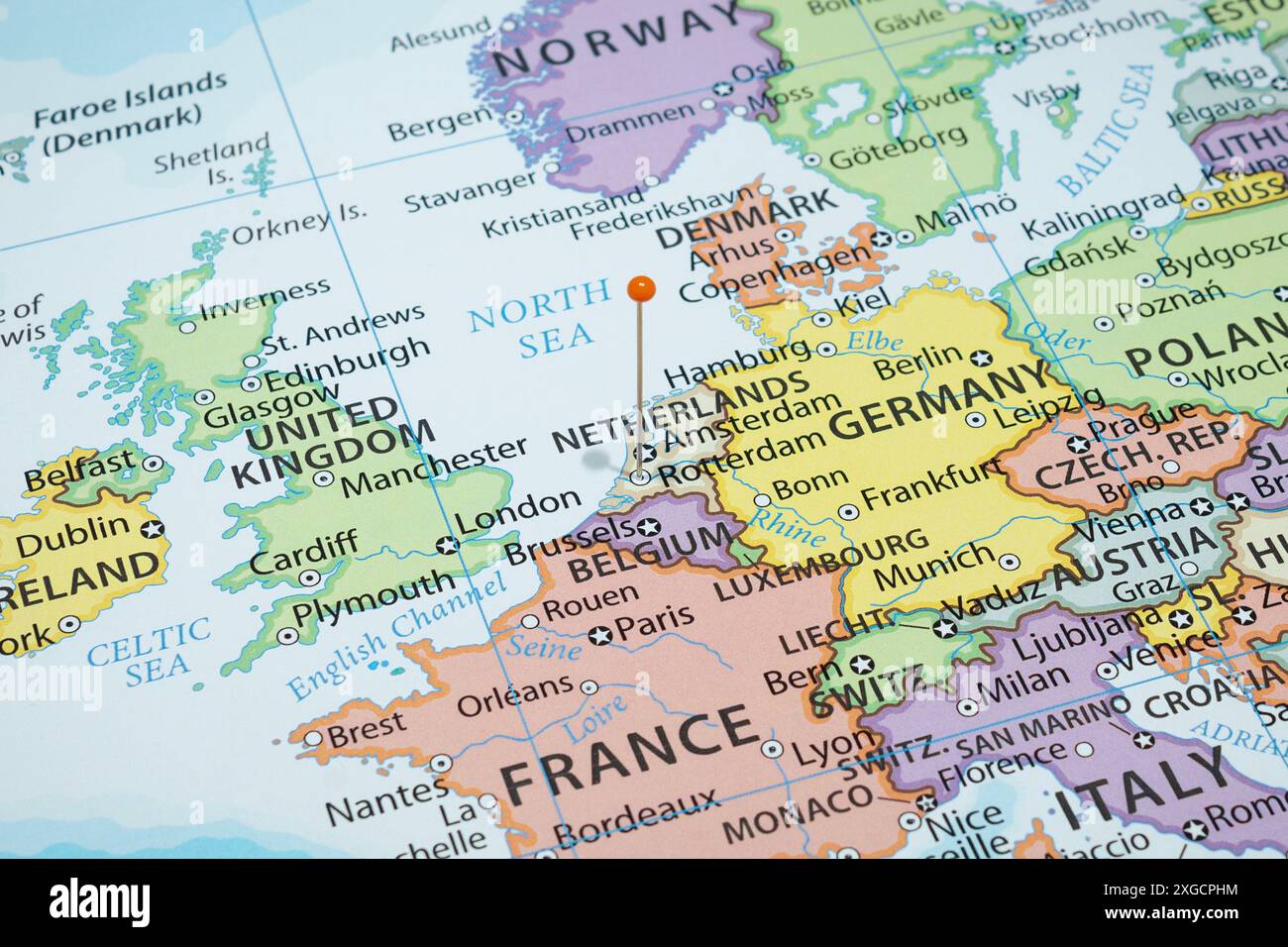 Close up to a Rotterdam city with an orange pin needle into Netherlands ...