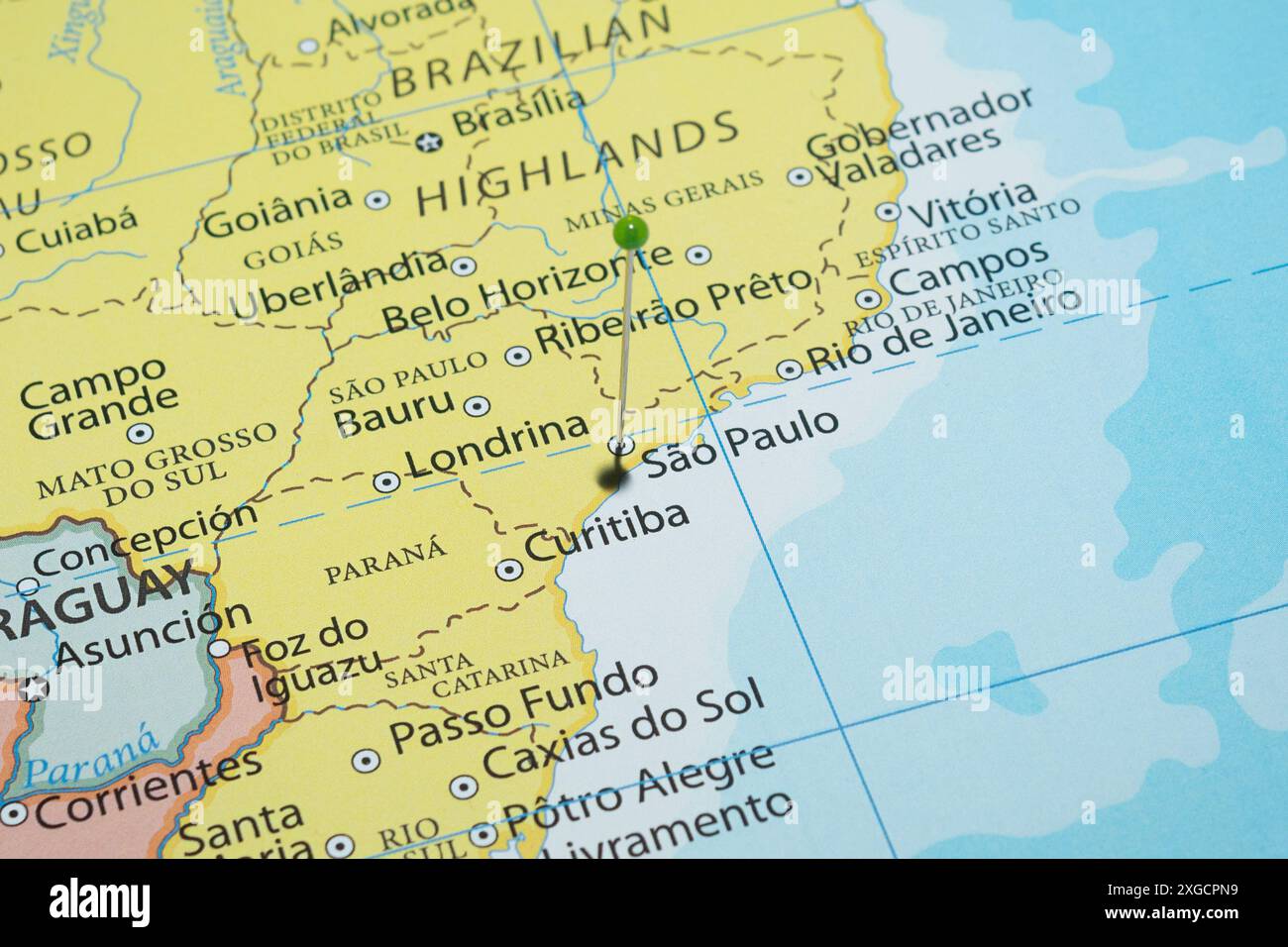 Close up to a Sao Paulo city with a green pin needle into brazil ...