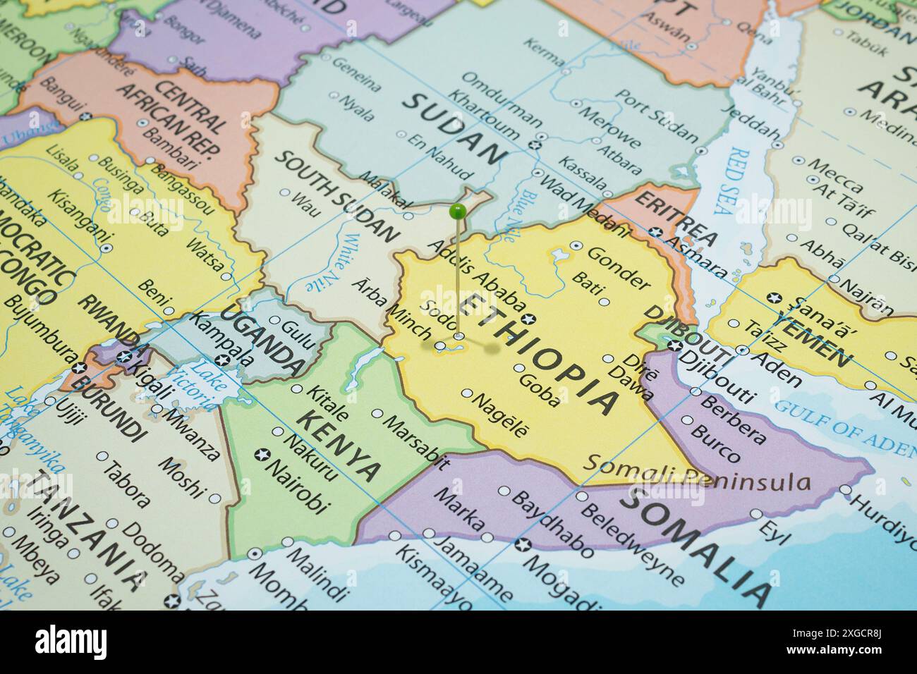 Close up to a Soddo city with a green pin needle into Ethiopia country ...