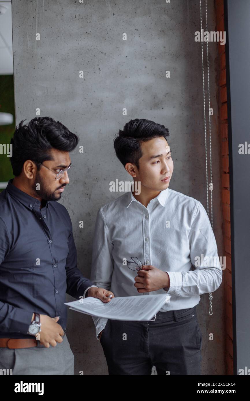 Indian business man standing against wall hi-res stock photography and images - Alamy