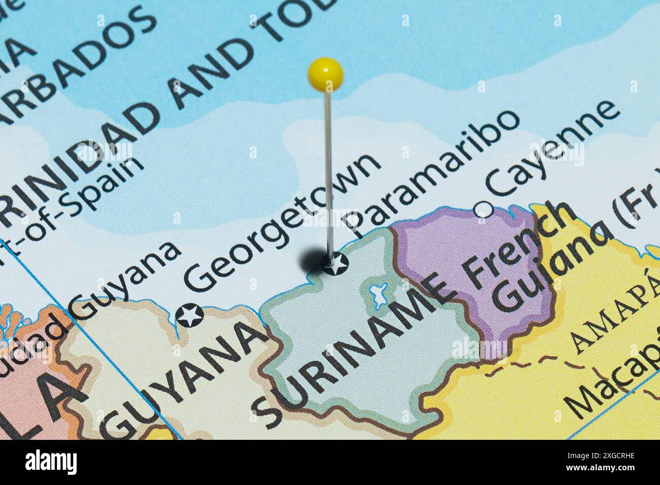 Close up to a Paramaribo city with a yellow pin needle into Suriname ...