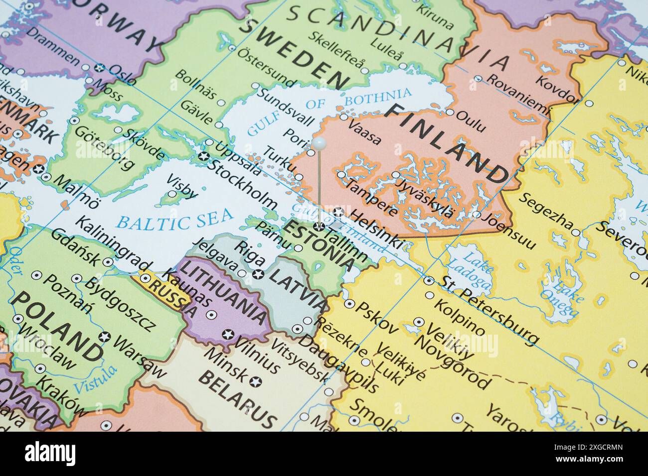 Close up to a Tallinn city with a white pin needle into Estonia country ...