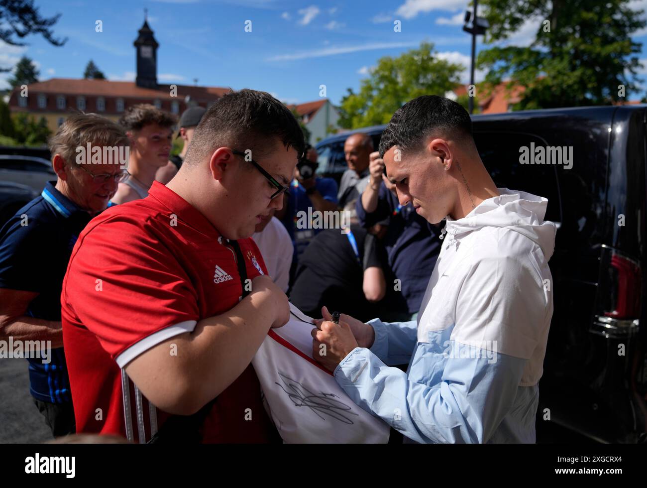 England's Phil Foden signs autographs outside the media center of ...