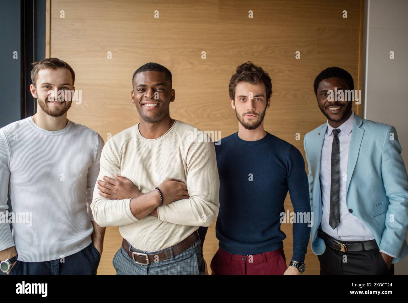 Portrait of creative business team dressed casually, standing together ...