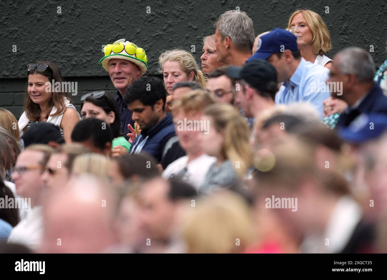 A spectator wearing a tennis themed hat on day eight of the 2024 ...