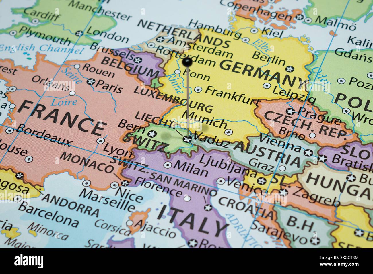 Close up to a vaduz city with a black pin needle into liechtenstein ...