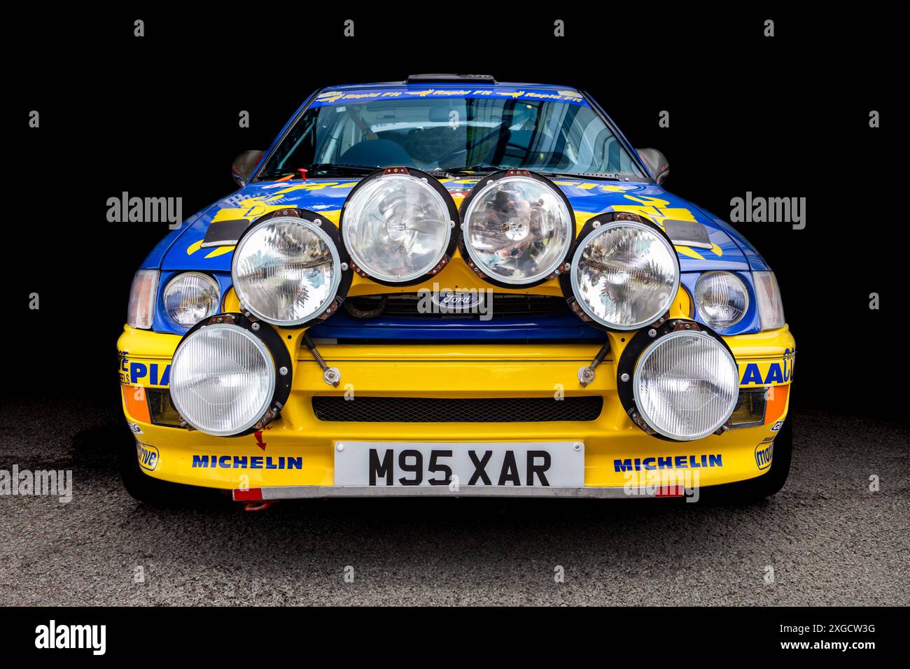 A parked Ford Escort Rs2000 rally car, featuring an impressive ...
