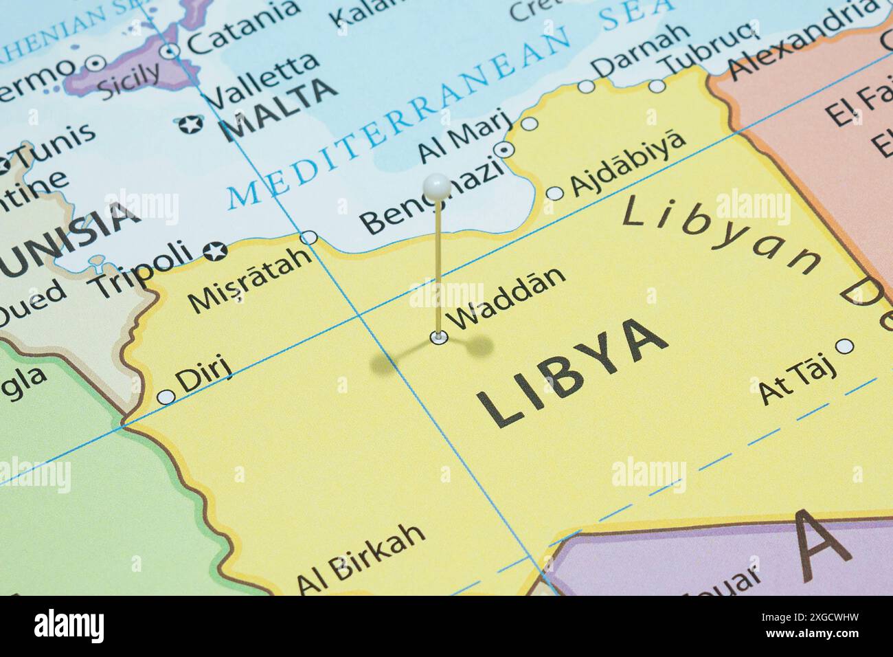 Close up to a Waddan city with a white pin needle into Libya country ...