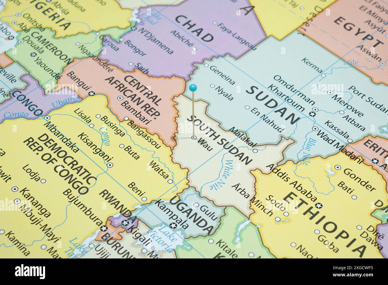 Close up to a Wau city with a light blue pin needle into South Sudan ...