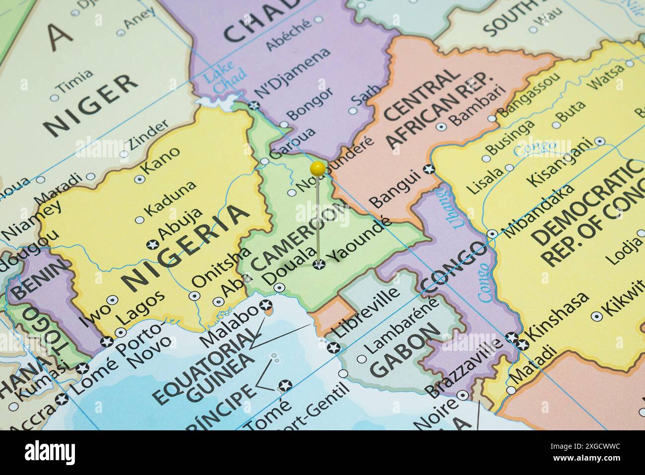 Close up to a Yaounde city with a yellow pin needle into Cameroon ...