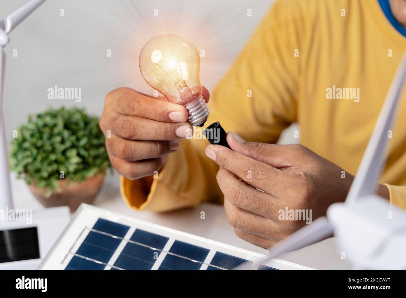 Energy engineers people holding light bulbs while thinking. Inspiration ...