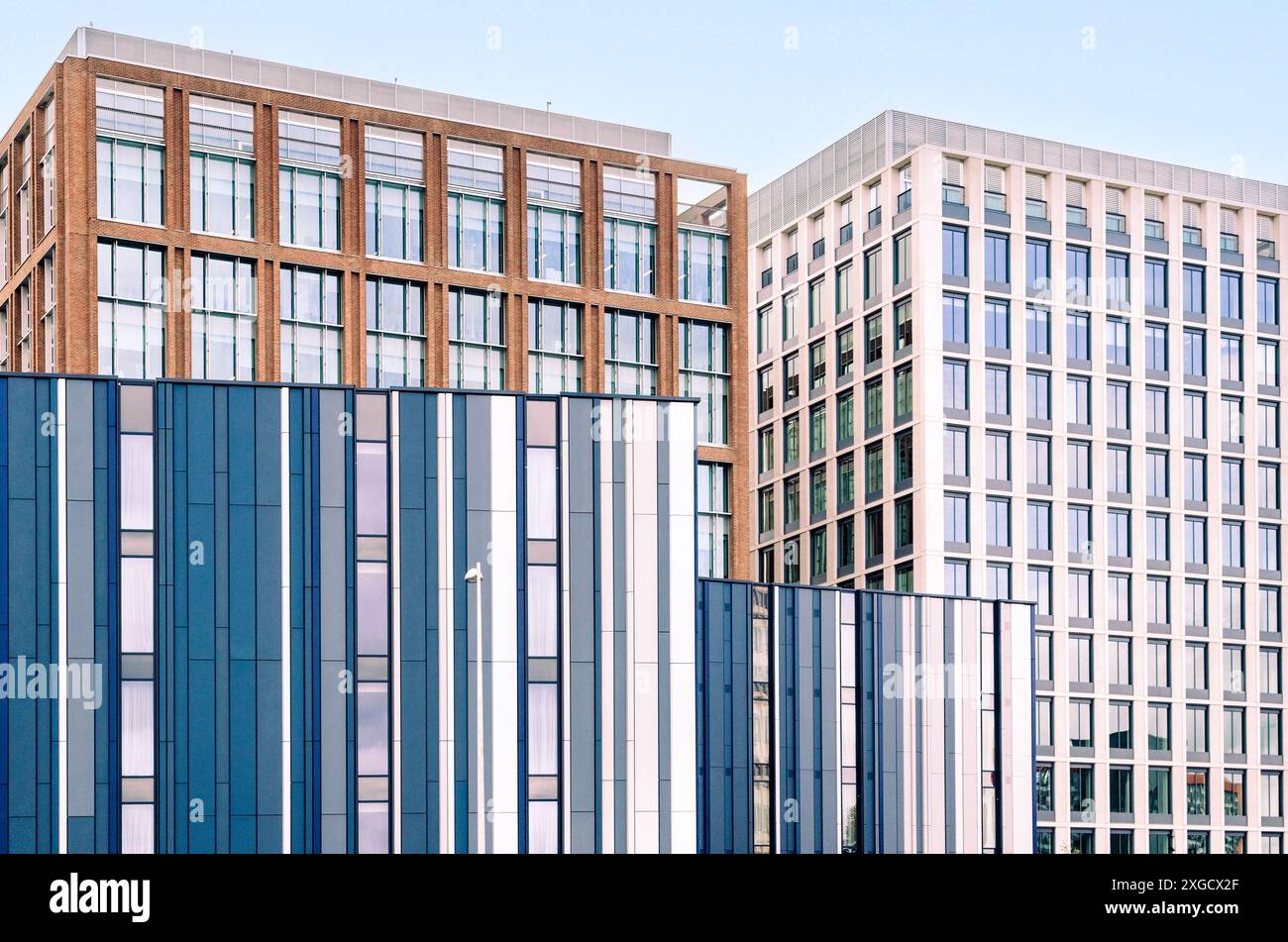 A cluster of modern buildings with strong geometric lines. Contemporary ...