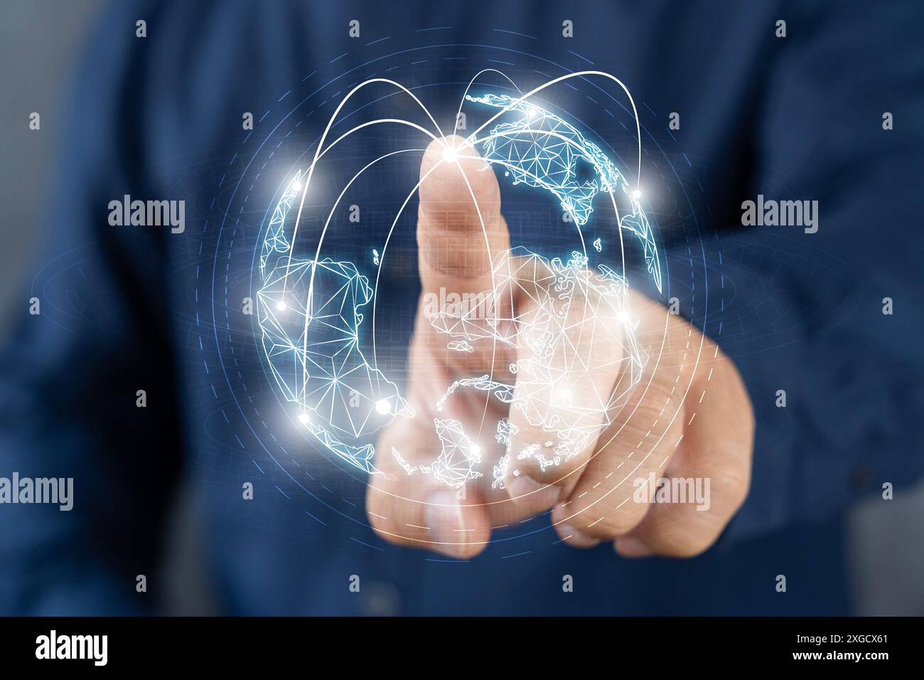 Hand pushing an earth button on the touch screen interface with the ...