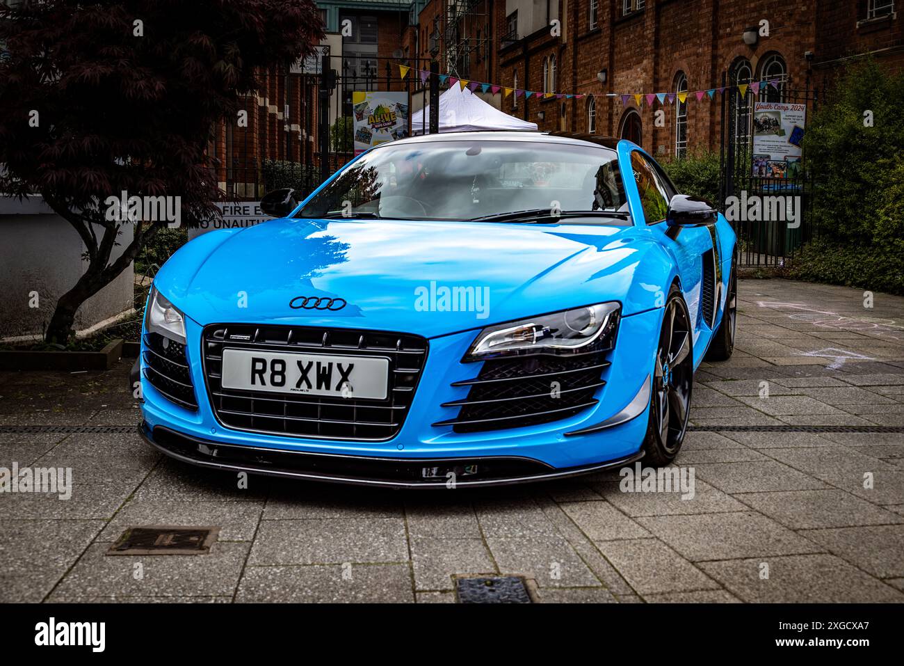 A sleek Audi R8 Spyder, with sharp lines, low stance, and exuding ...