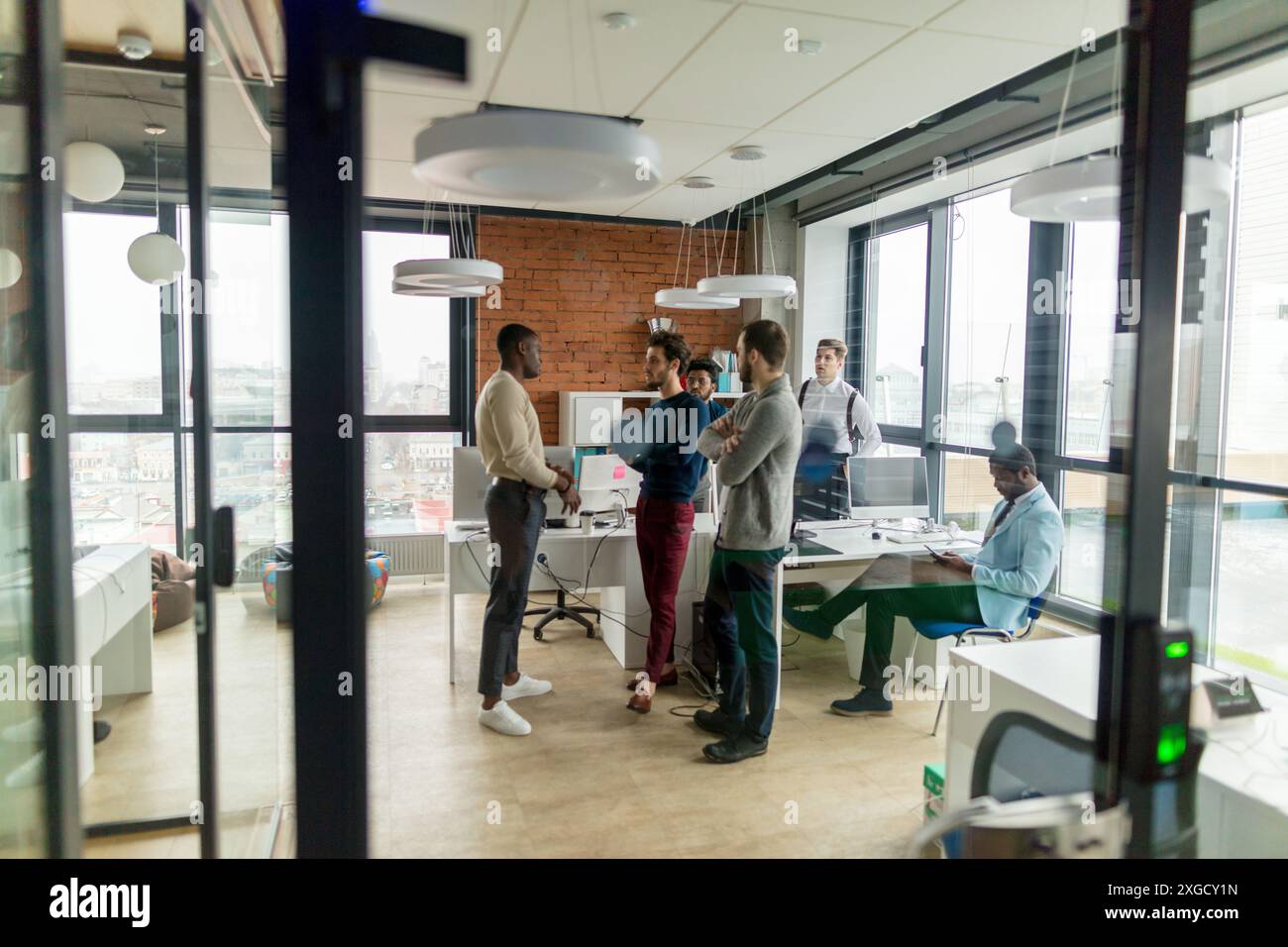 Long distance picture of multiracial male creative team of software ...