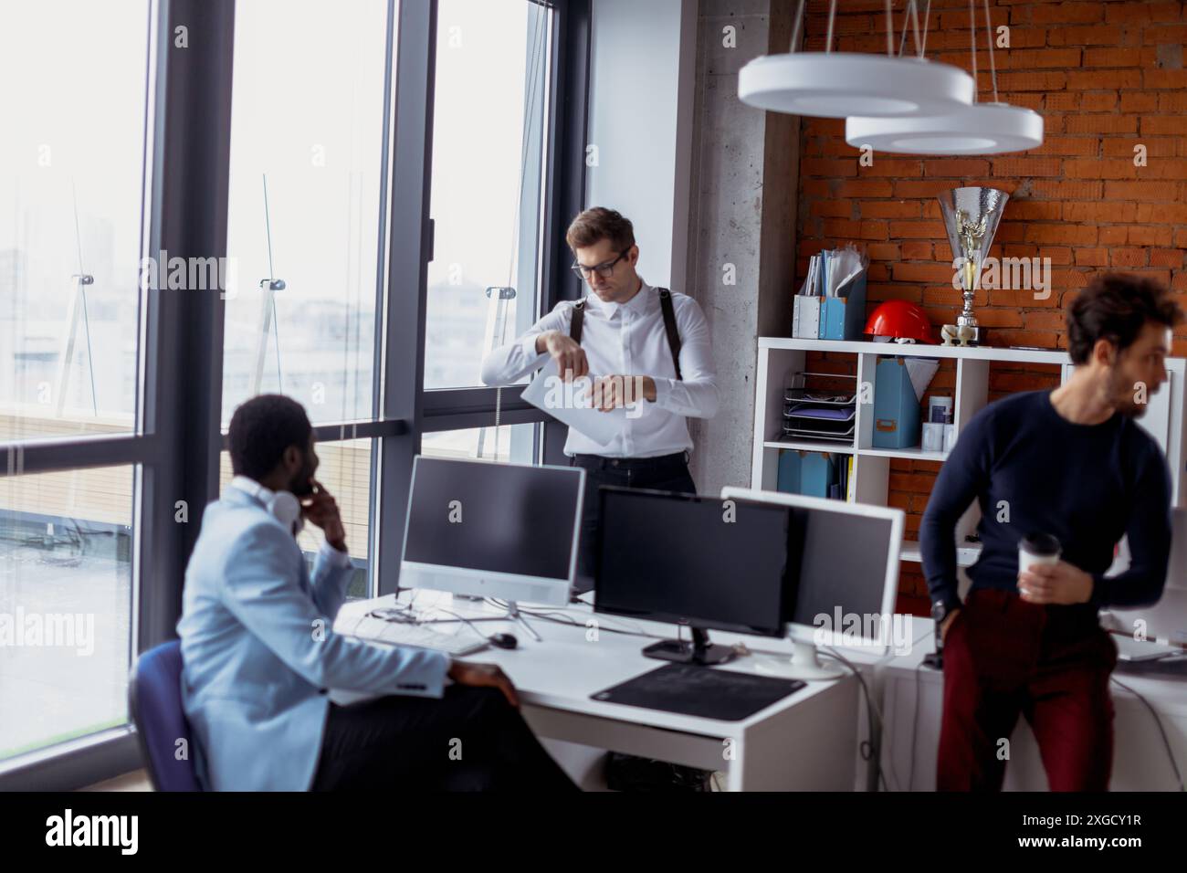 Multi Ethnic group of male architectures and web-designers standing ...