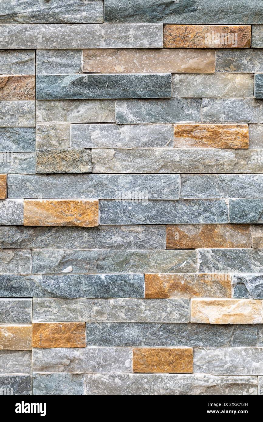 A multi-colored stone wall, showcasing the texture and detail of the ...