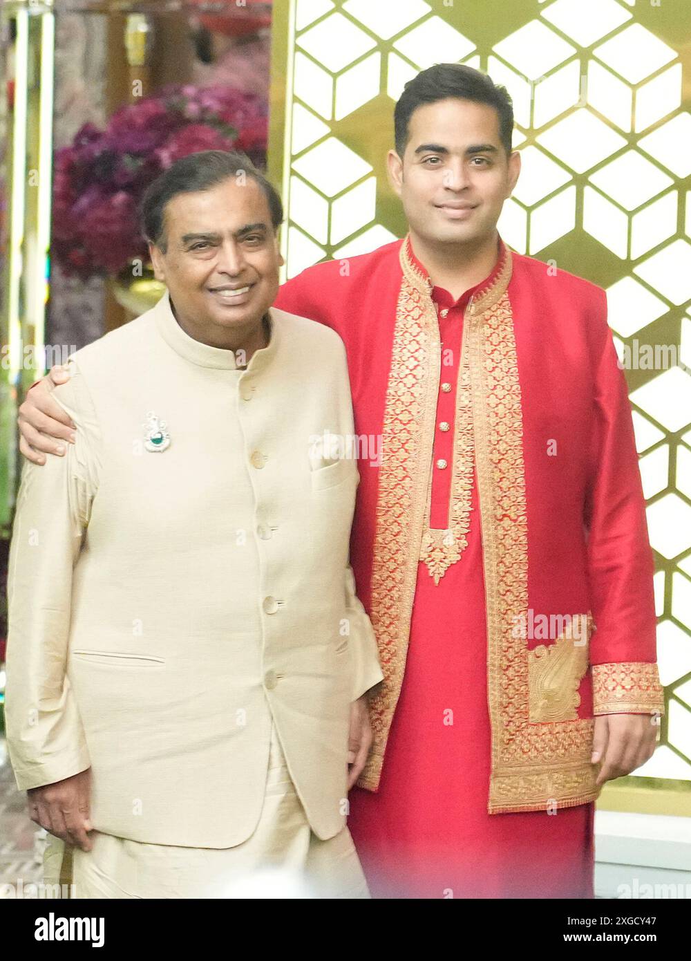 Chairman of Reliance Industries Limited Mukesh Ambani, left, and his ...