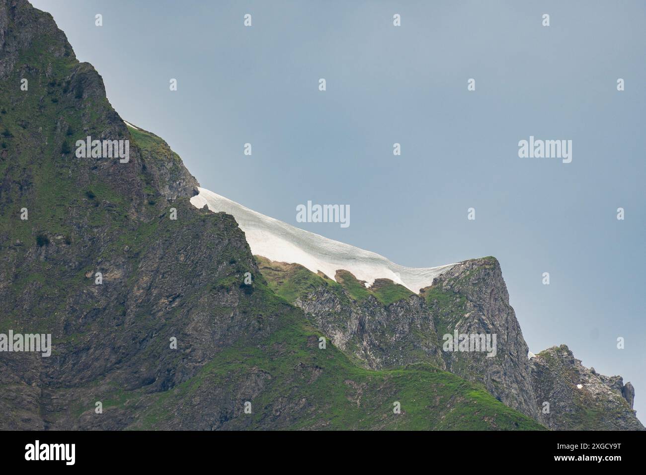 snow field in the mountain, Cornices, snowdrifts on the peak ...