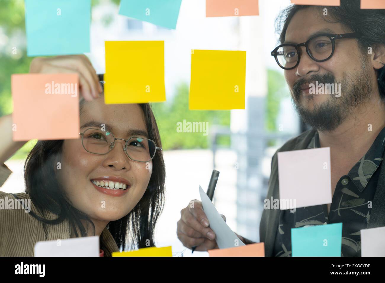 Young office employees is brainstorming to plan a successful project ...