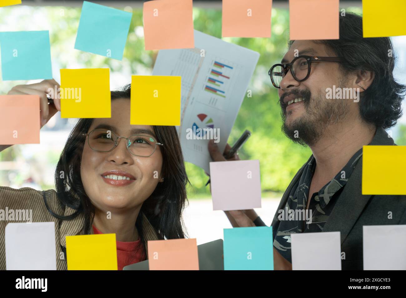 Young office employees is brainstorming to plan a successful project ...