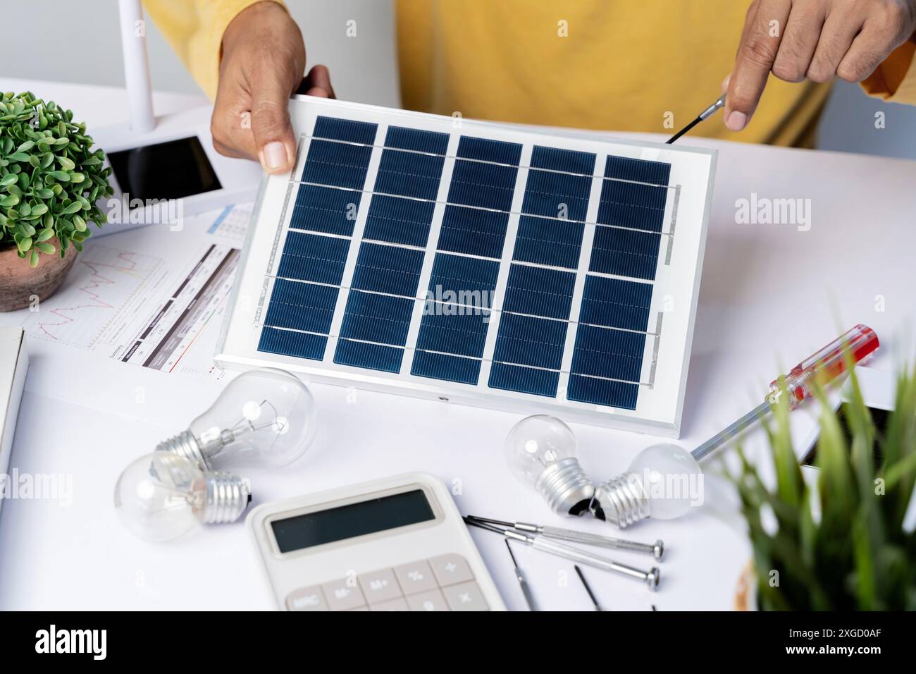 Architect is reviewing house blueprint project plan with wind turbine ...