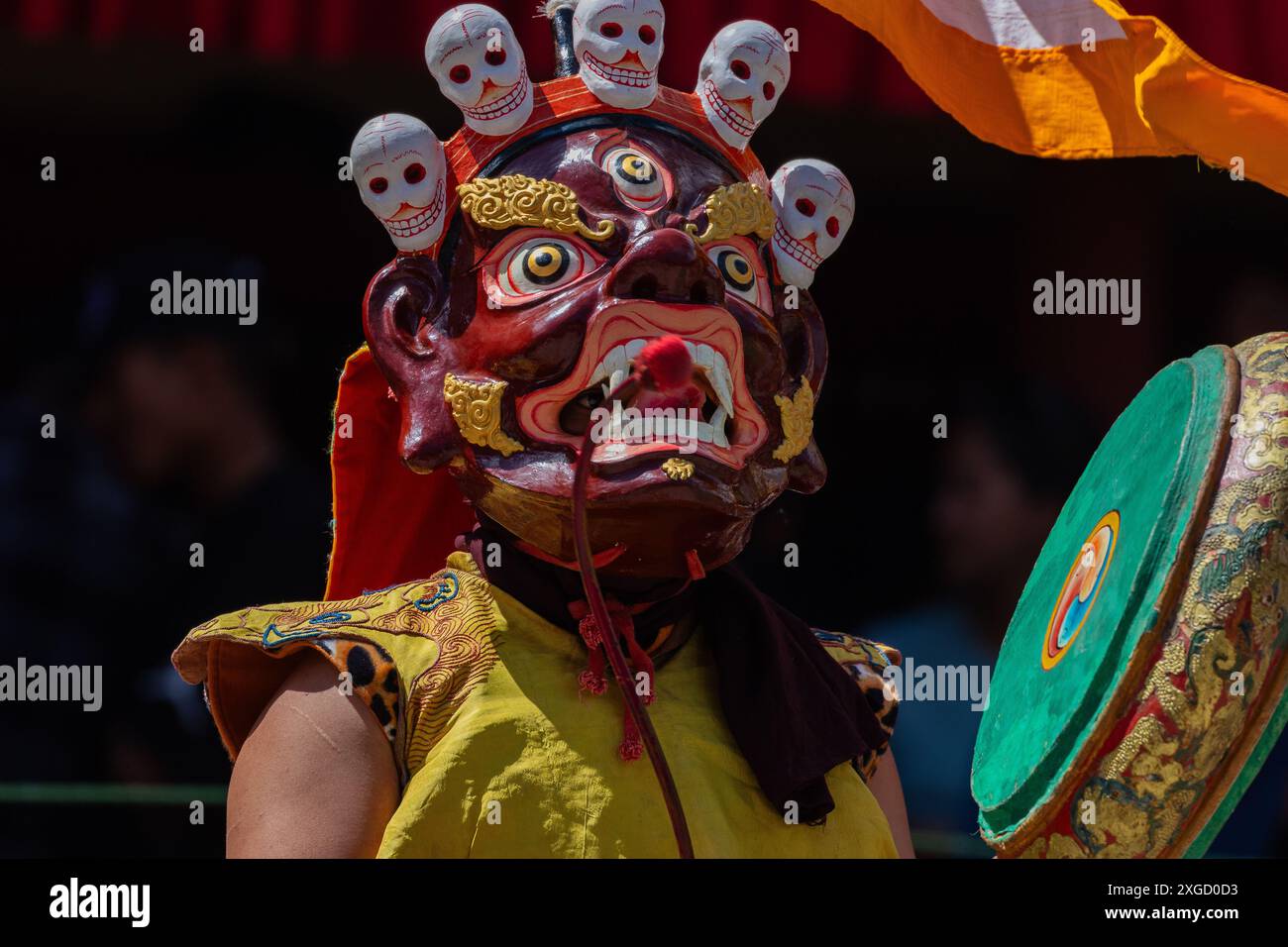 A colorful mask dance and drum beating being performed at Hemis ...