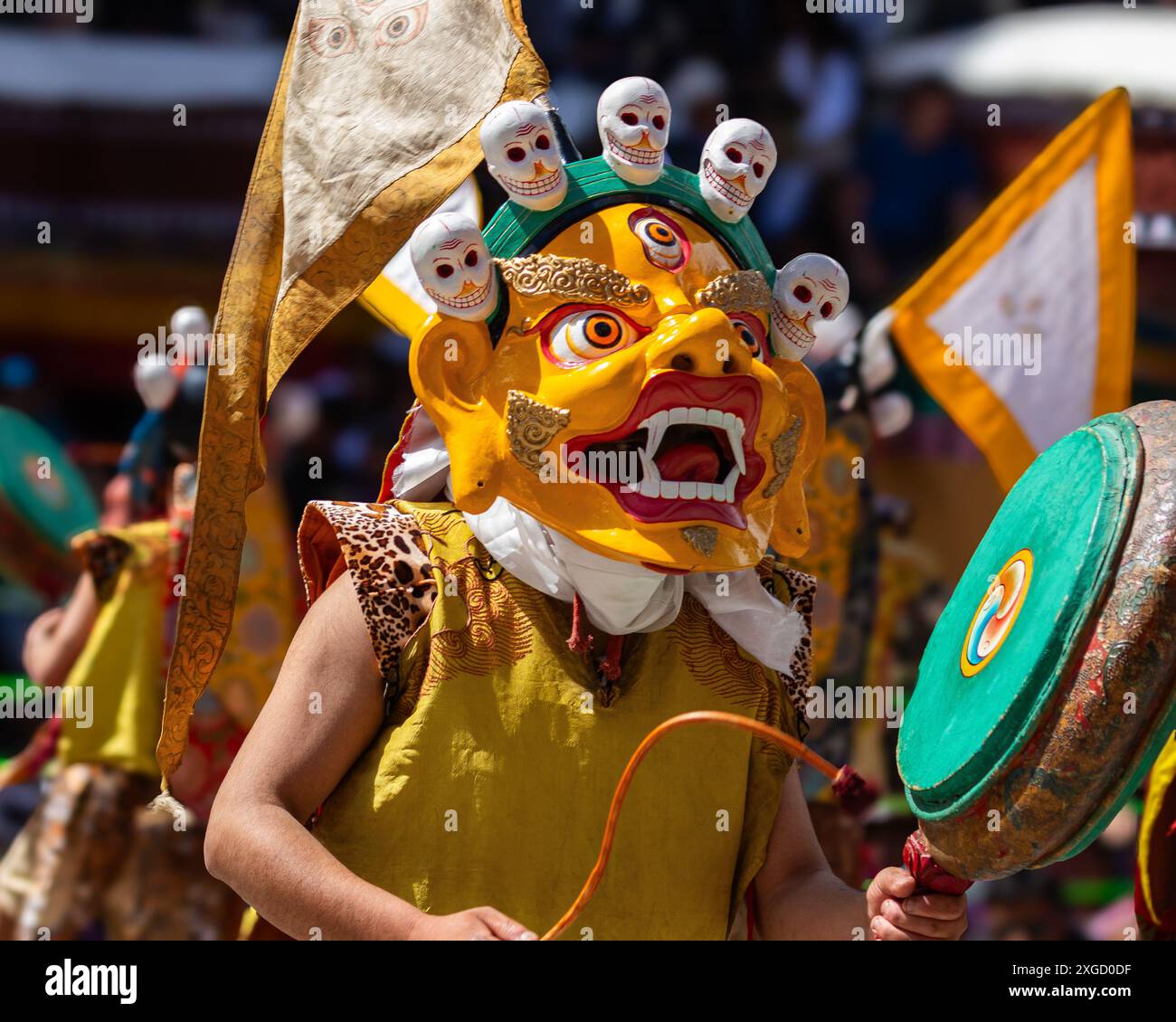 A colorful mask dance and drum beating being performed at Hemis ...