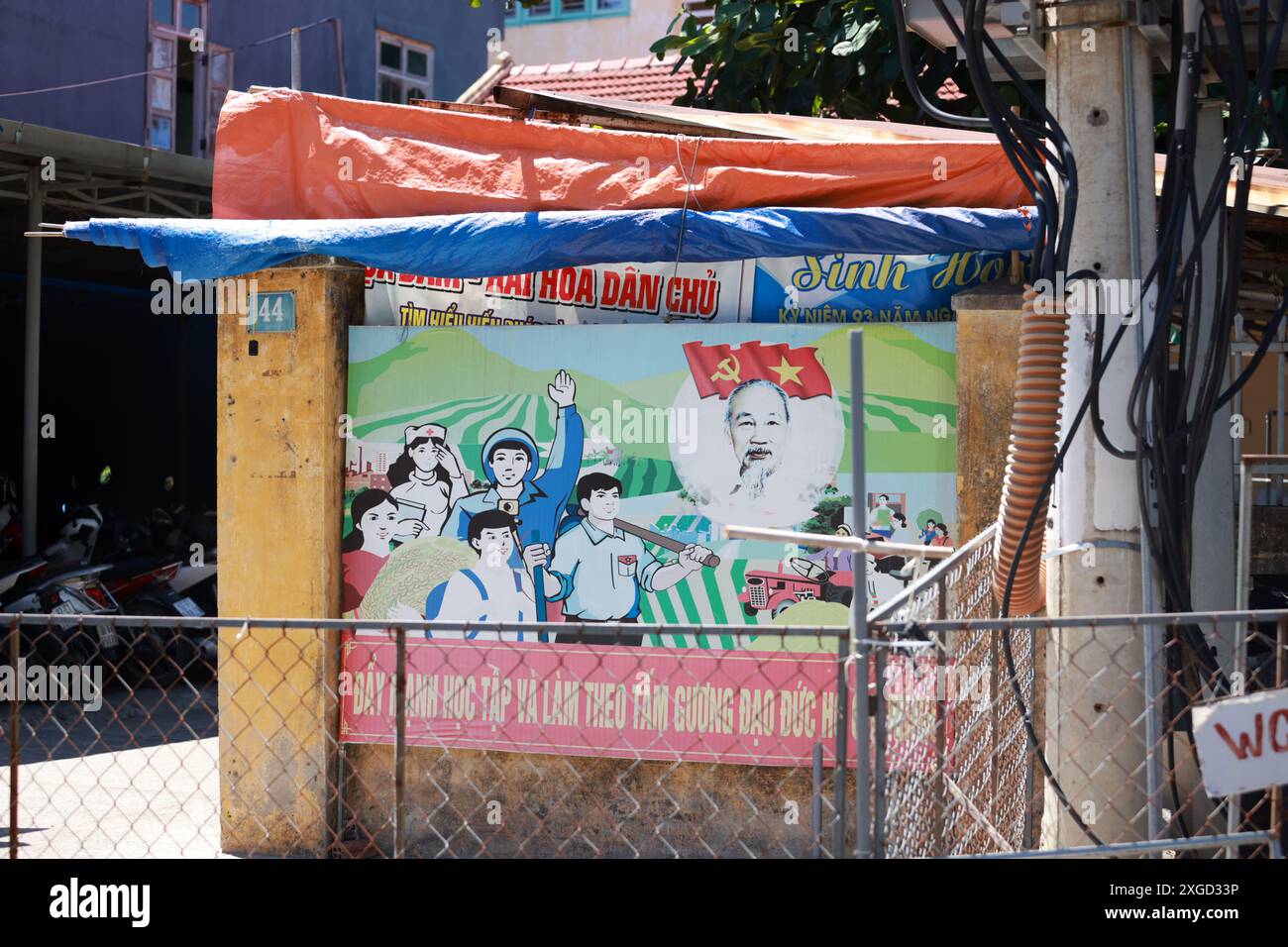 A Soviet style slogan on the wall "encourage learning and following ...