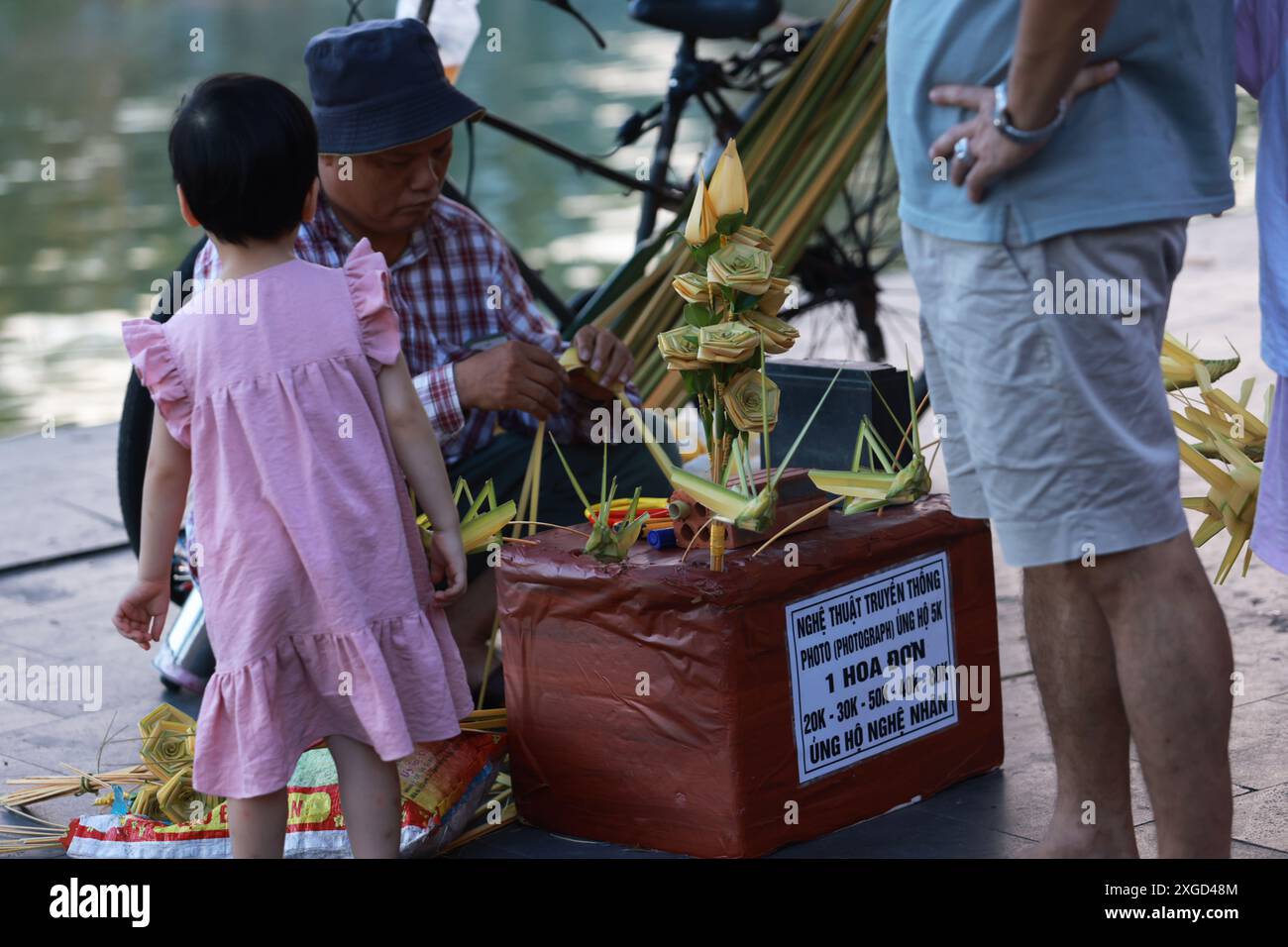 Hoi An, Vietnam July 7 2024: the hawker sell the grasshopper, made by ...