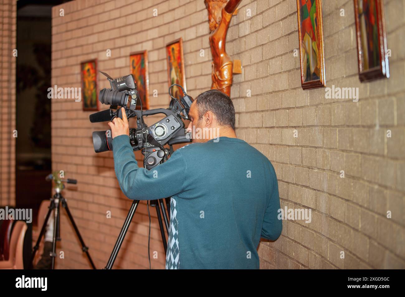religious camera operator cameraman , filming mass, operating video ...
