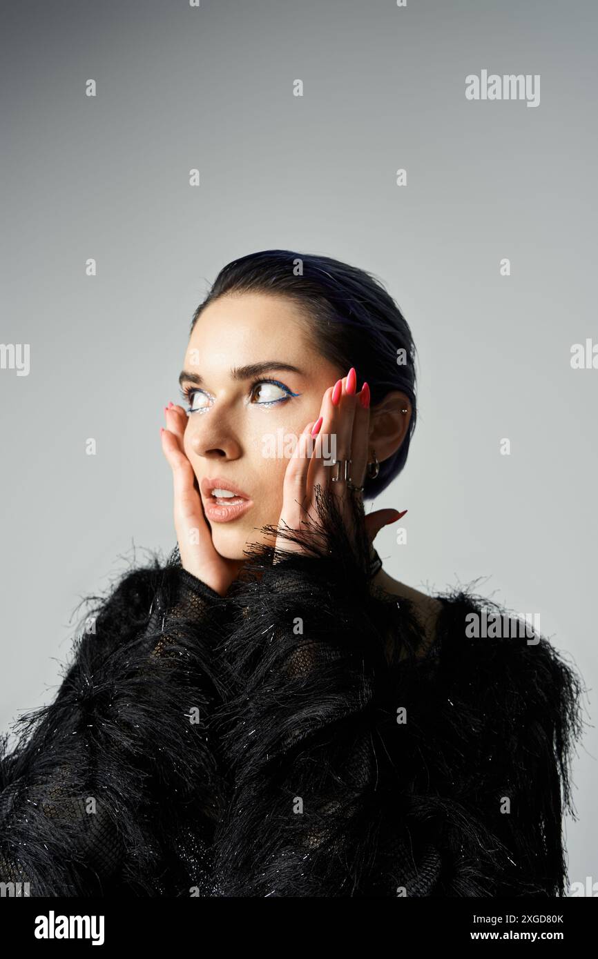 A stylish young woman with short dyed hair strikes a pose in a chic fur ...