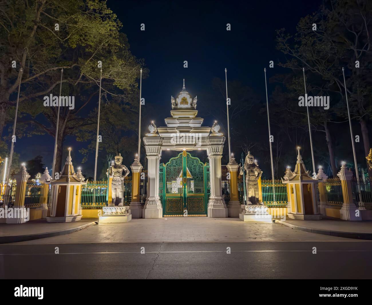 Entrance gate to a government building at night in Siem Reap, Cambodia ...