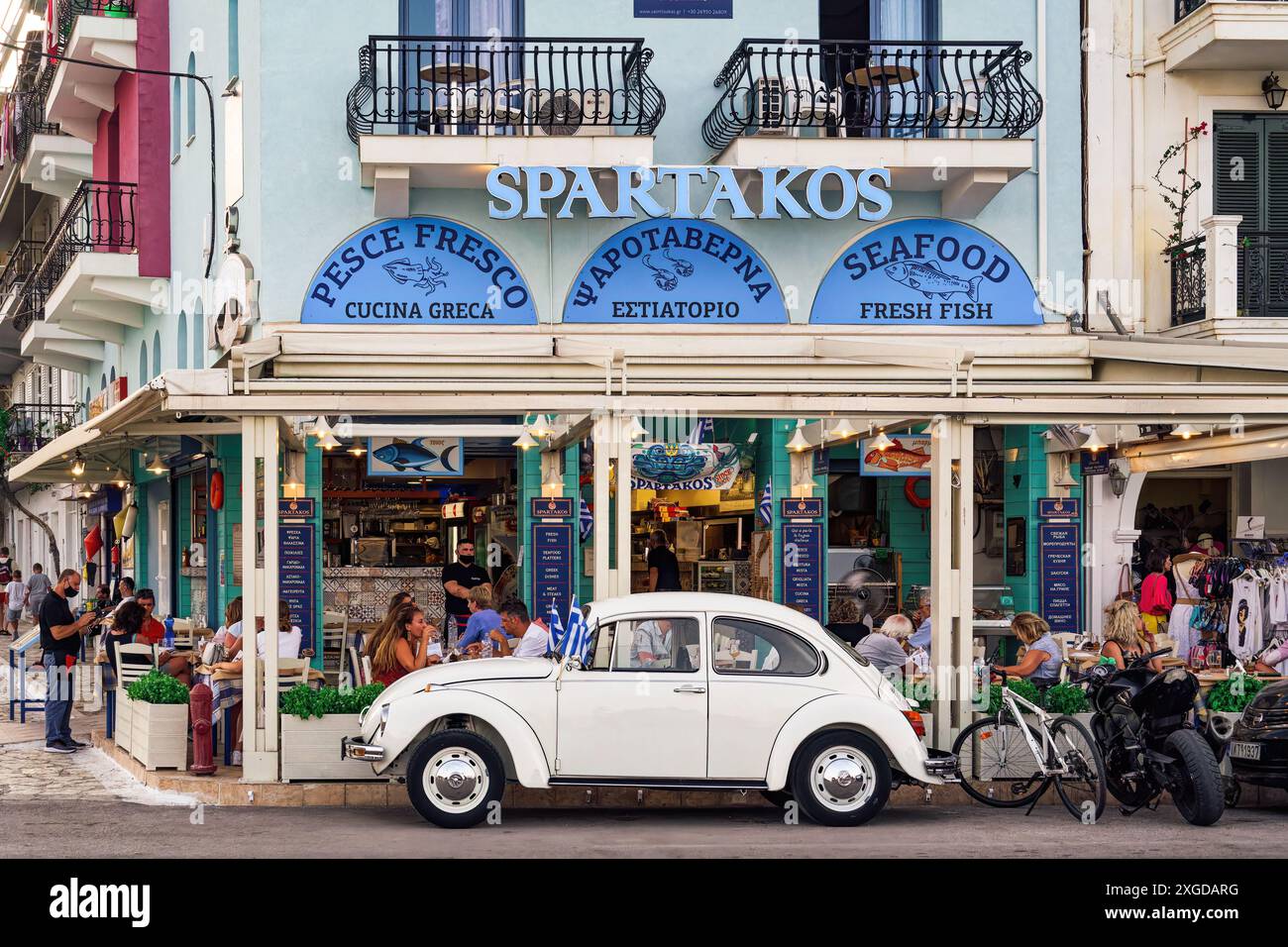 Traditional outdoor seating area of tavern with crowd and vintage ...