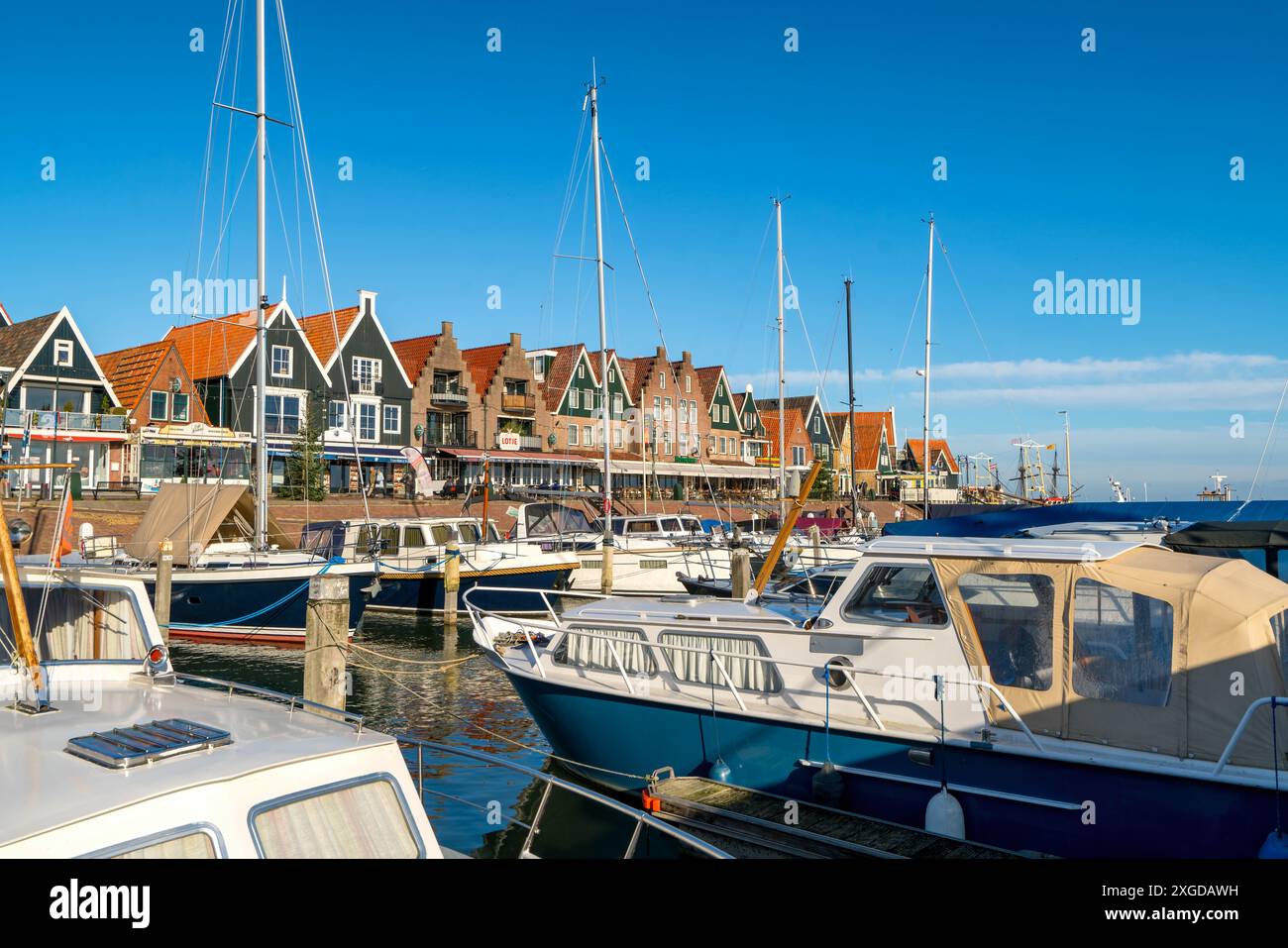Volendam marina with boats and traditional Dutch buildings in the ...