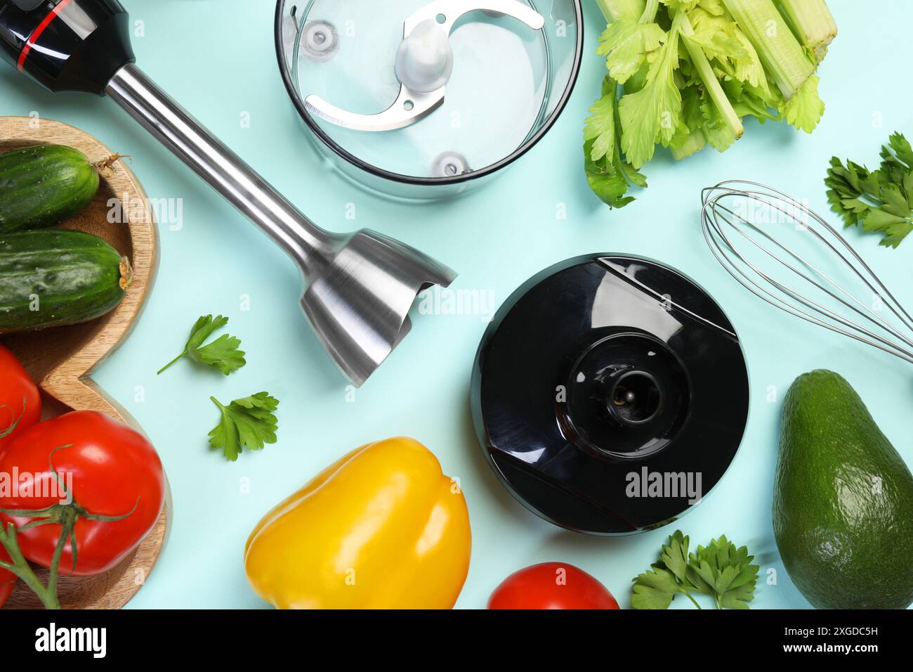 Hand blender kit and fresh products on light blue background, flat lay ...