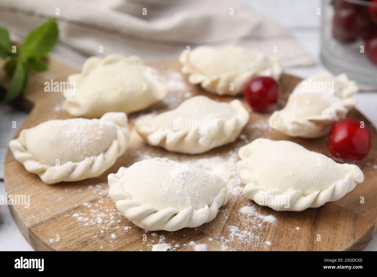 Raw dumplings varenyky cherries hi-res stock photography and images - Alamy