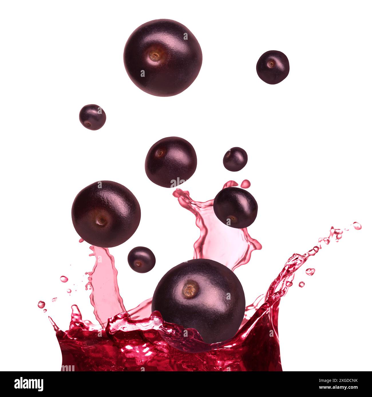 Acai berries falling into juice on white background Stock Photo - Alamy