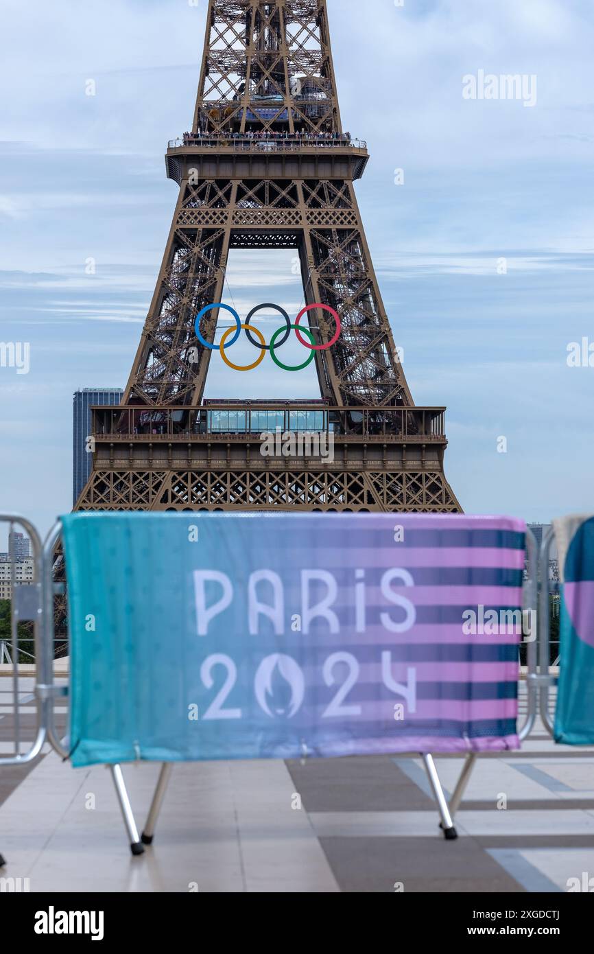 Paris, France - July 5, 2024 : View of the Paris 2024 Olympic Games logo and the Eiffel Tower on ...