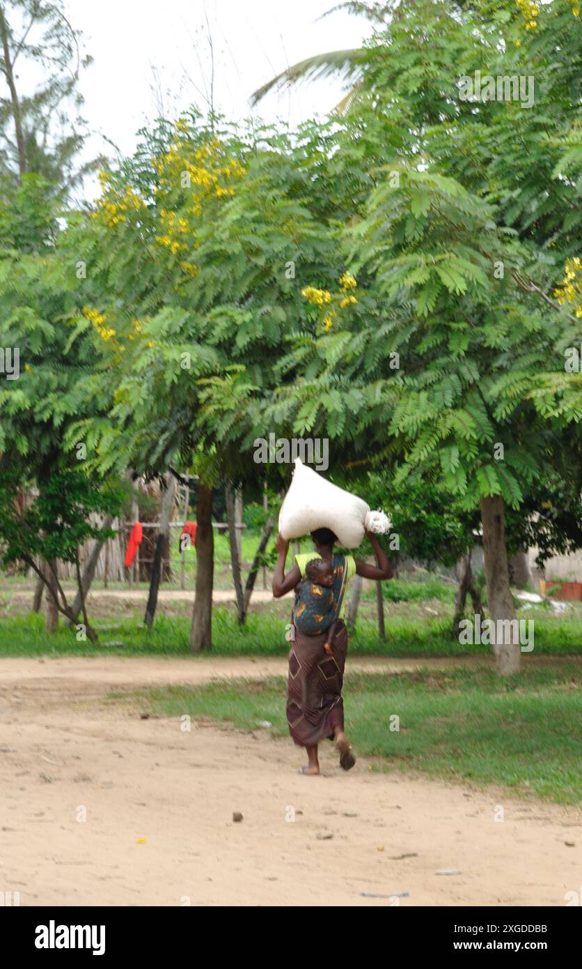 Young woman carrying a sack of grain hi-res stock photography and ...